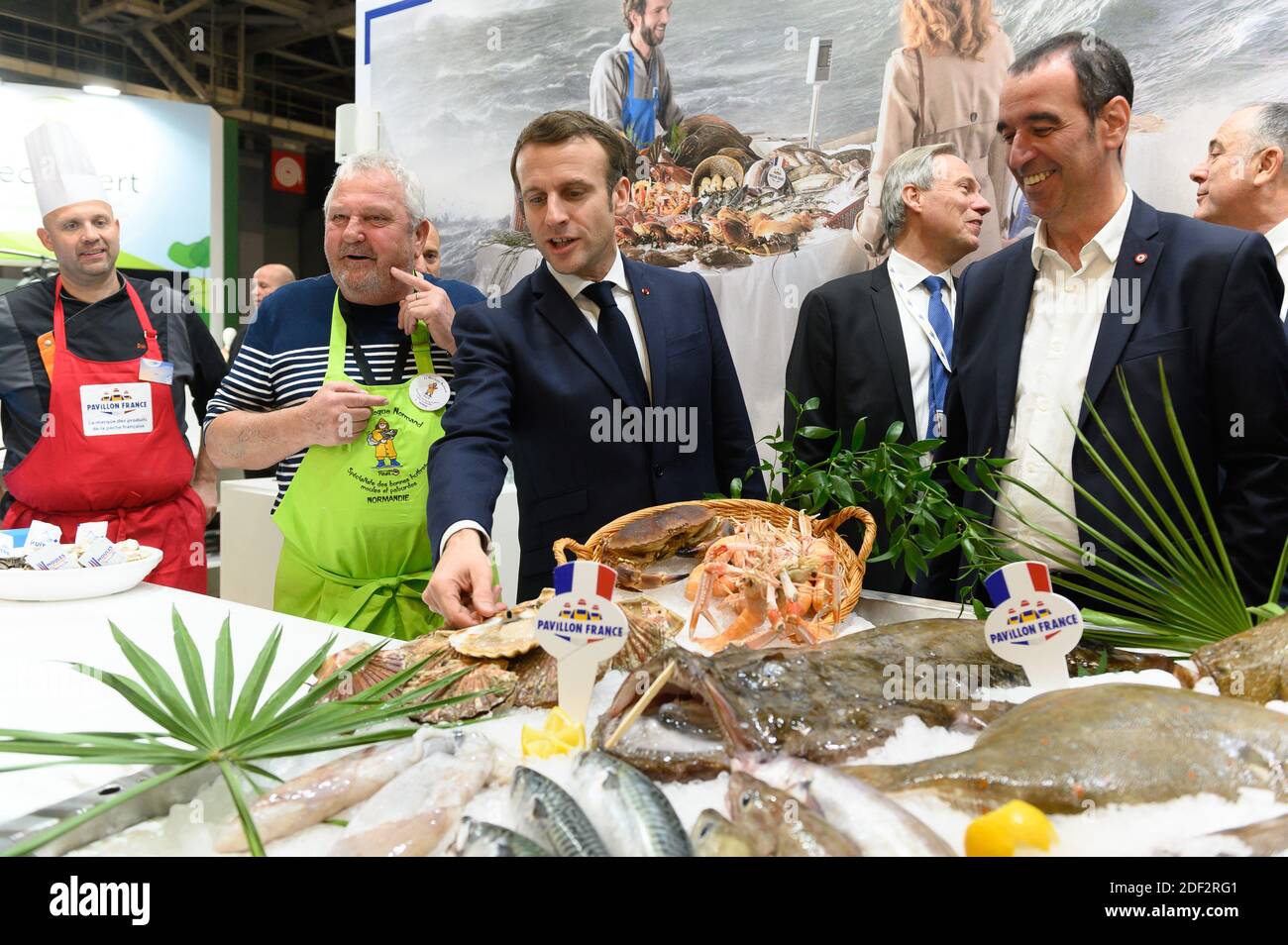 Guests, Emmanuel Macron, Jacques Woci and Eric Bothorel. French ...