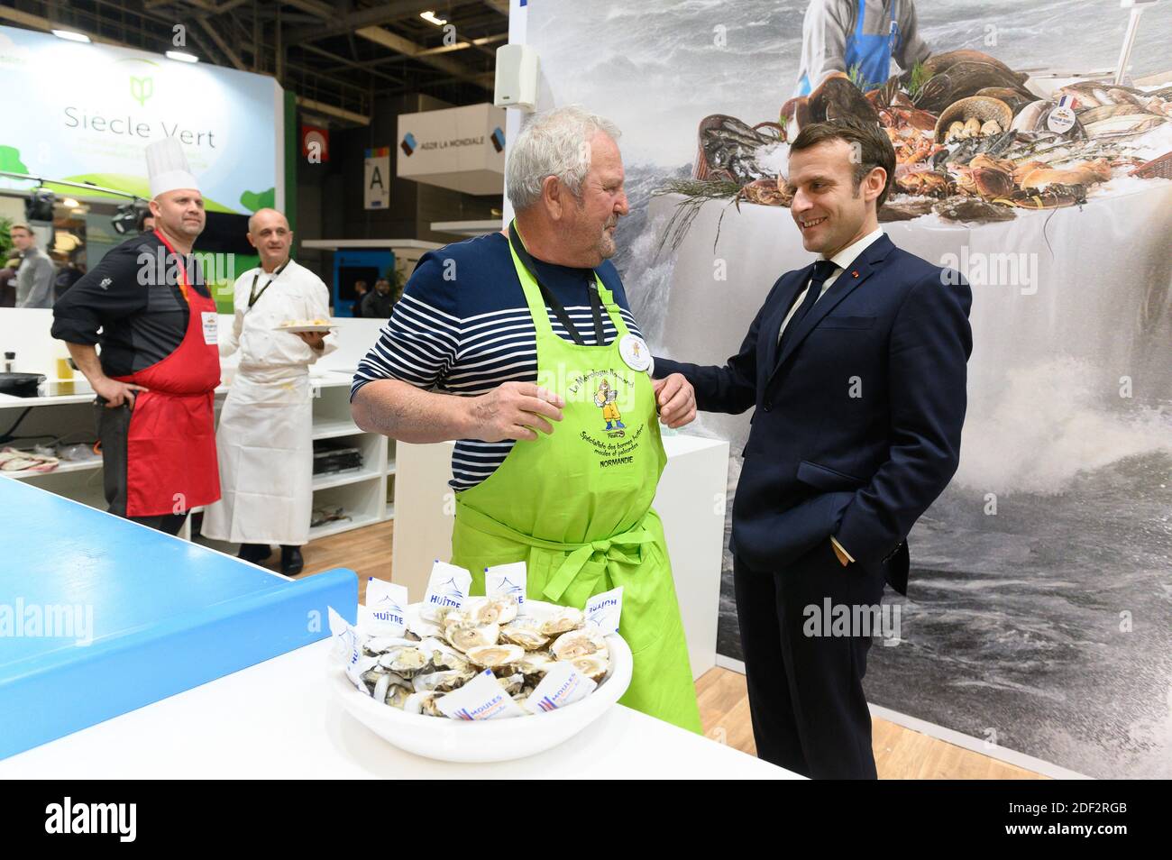 A guest and Emmanuel Macron. French President Emmanuel Macron visits ...