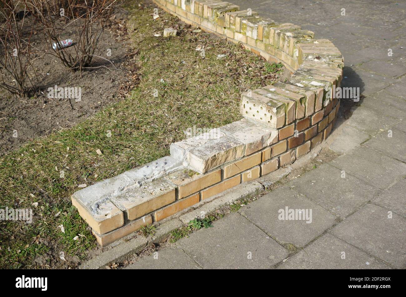 A wall made of several rectangular stones in the middle of the ...