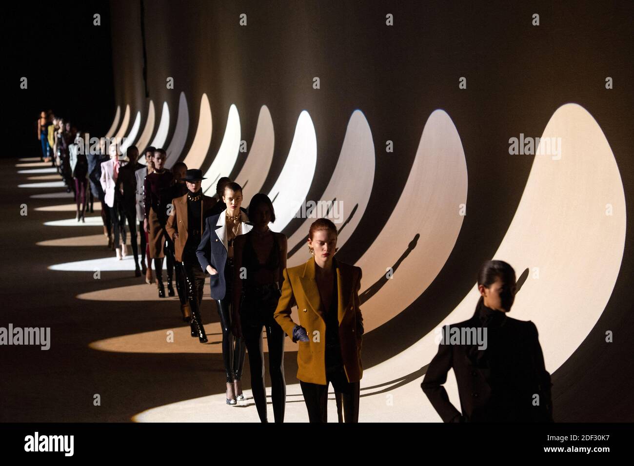 Models walk the runway during the Yves Saint-Laurent show as part of ...