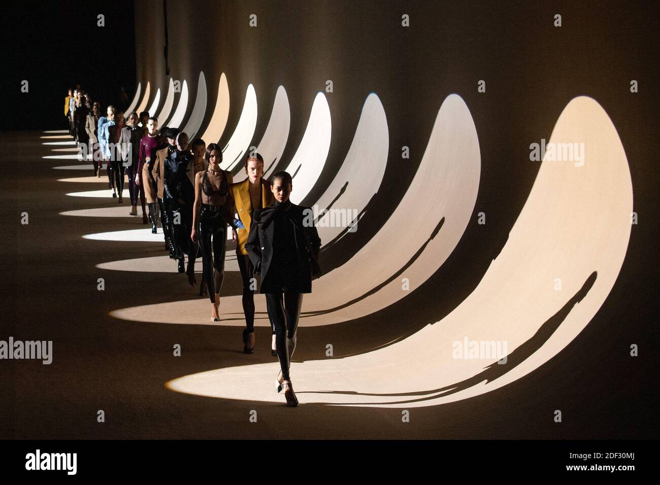 Models walk the runway during the Yves Saint-Laurent show as part of ...