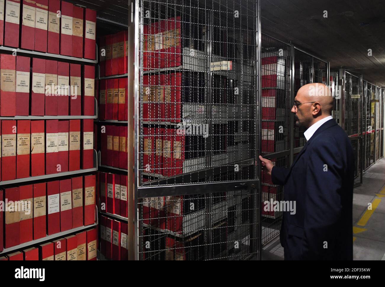 An attendant opens the section of the archive dedicated to Pope Pius ...