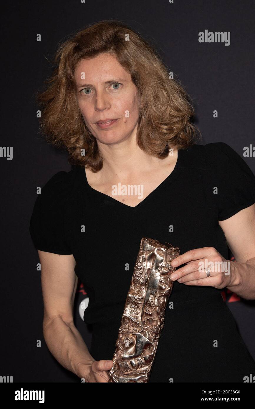 Claire Mathon poses with the Best Cinematographer award for 'Portrait ...