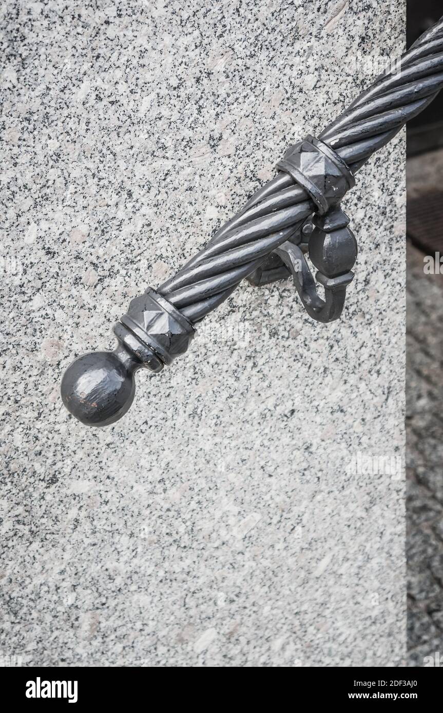 Metal handrail on a hard stone wall Stock Photo - Alamy