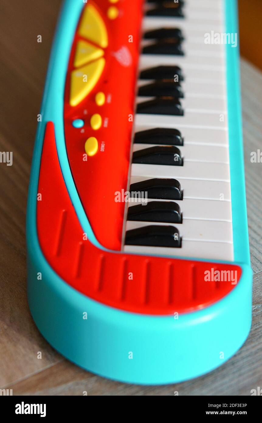 A vertical shot of a colorful keyboard for kids Stock Photo - Alamy