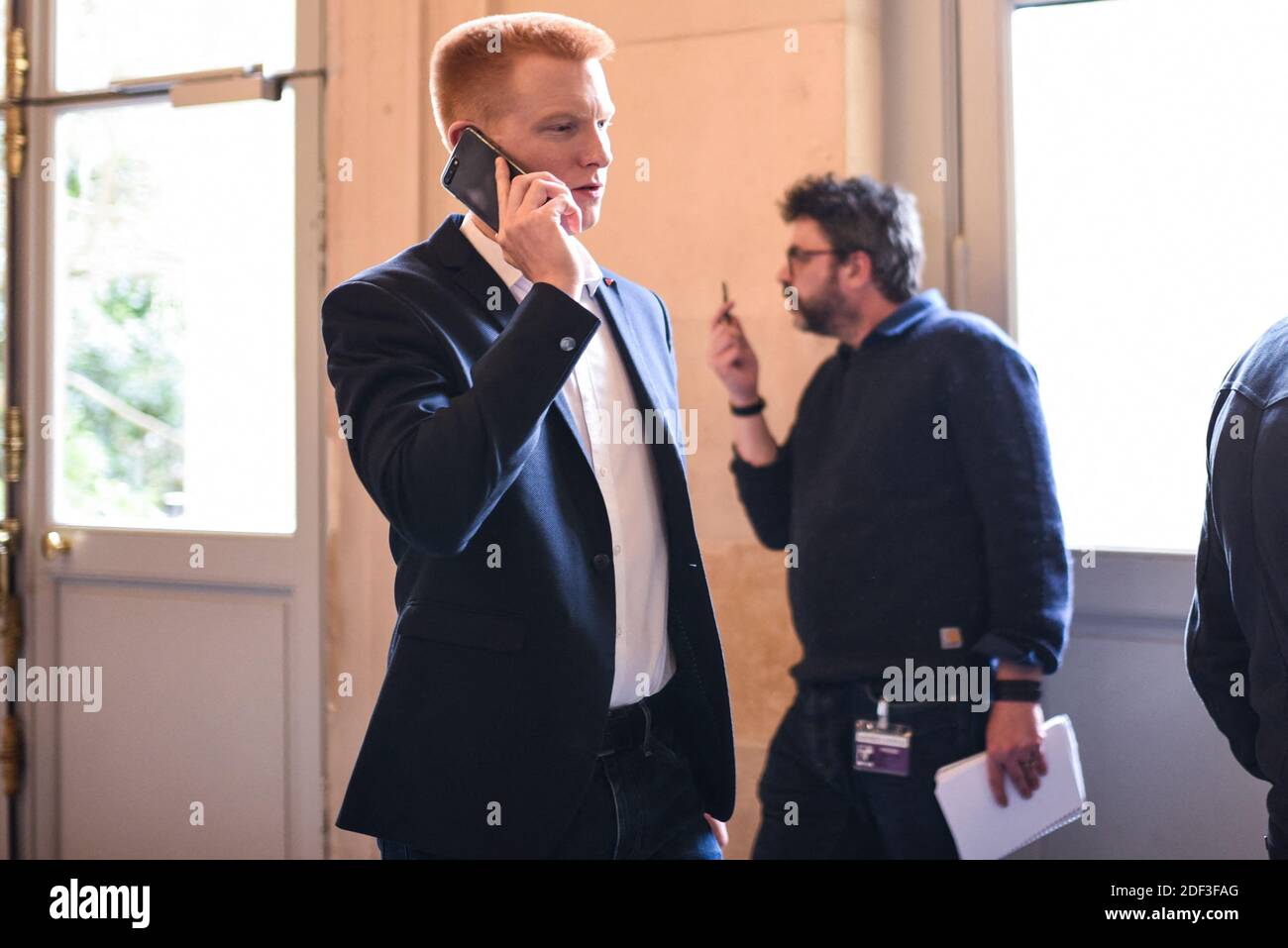 La France Insoumise (LFI) MP Adrien Quatennens speaks on the phone at ...