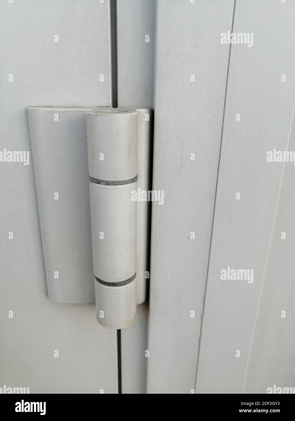 Vertical shot of the hinges of a white door Stock Photo - Alamy