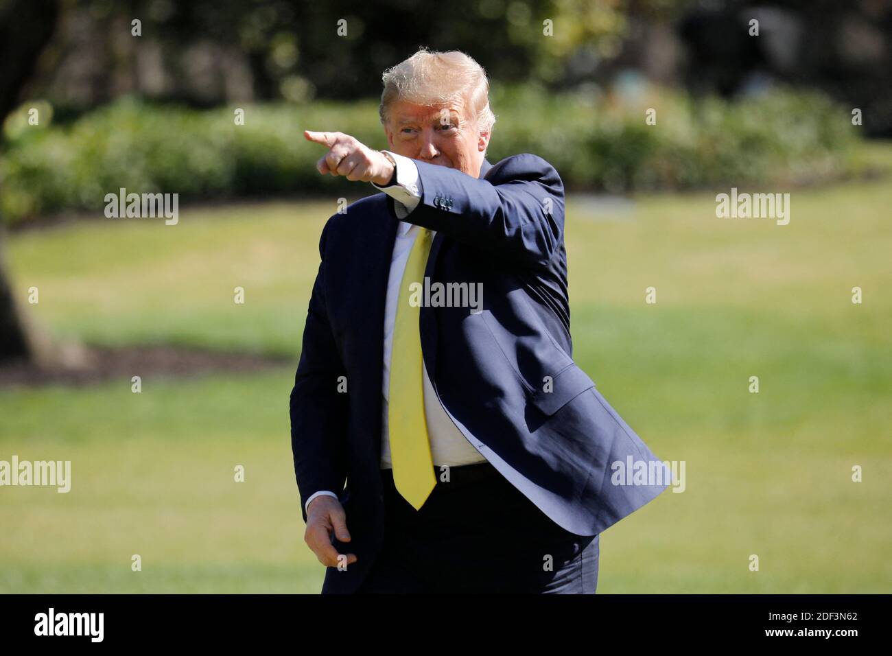 U.S. President Donald Trump gestures as he walks on the South Lawn of ...