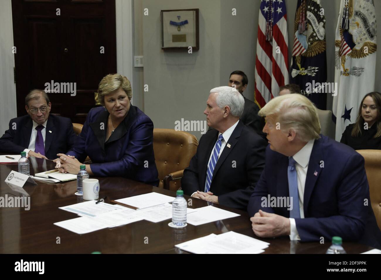 U.S. President Donald Trump listens to Gail Boudreaux of Anthem during ...