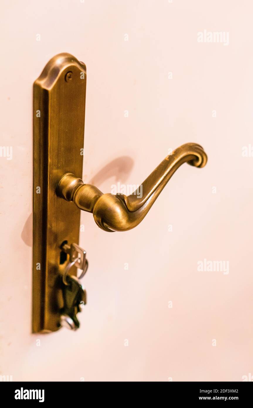 A beautiful shot of a metal handler of a locked door Stock Photo - Alamy