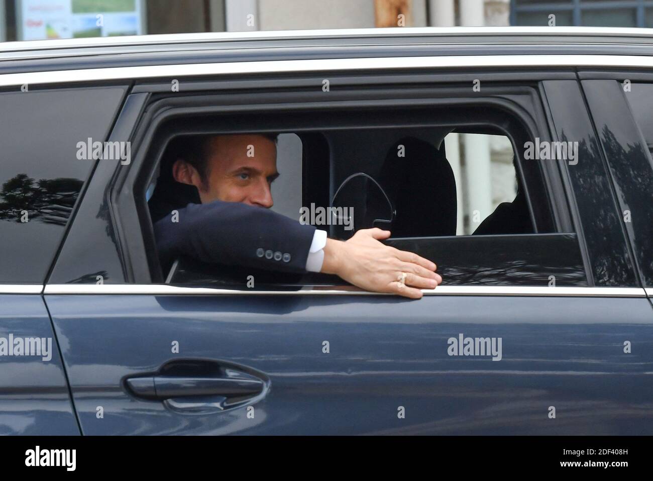 French President Emmanuel Macron leaves his house to return to the ...