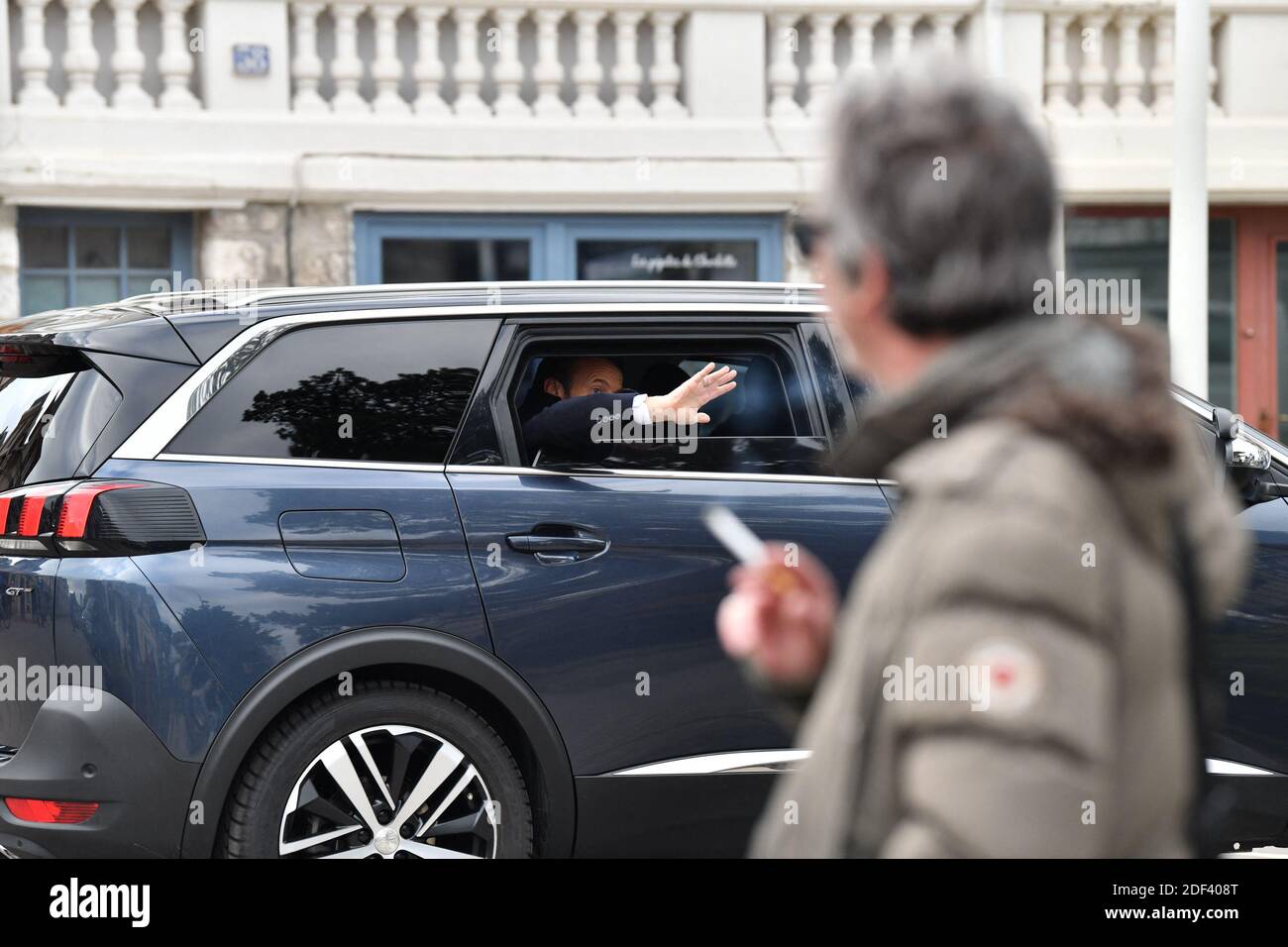 French President Emmanuel Macron leaves his house to return to the ...