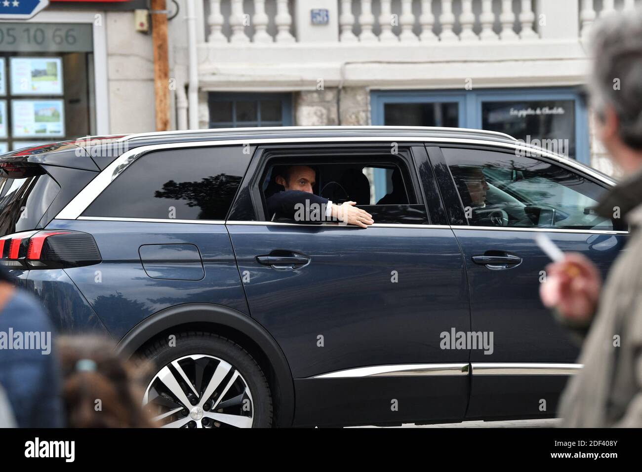 French President Emmanuel Macron leaves his house to return to the ...