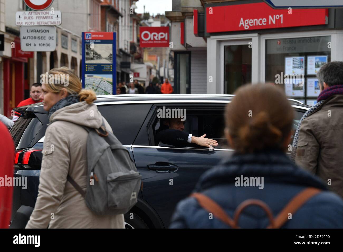 French President Emmanuel Macron leaves his house to return to the ...