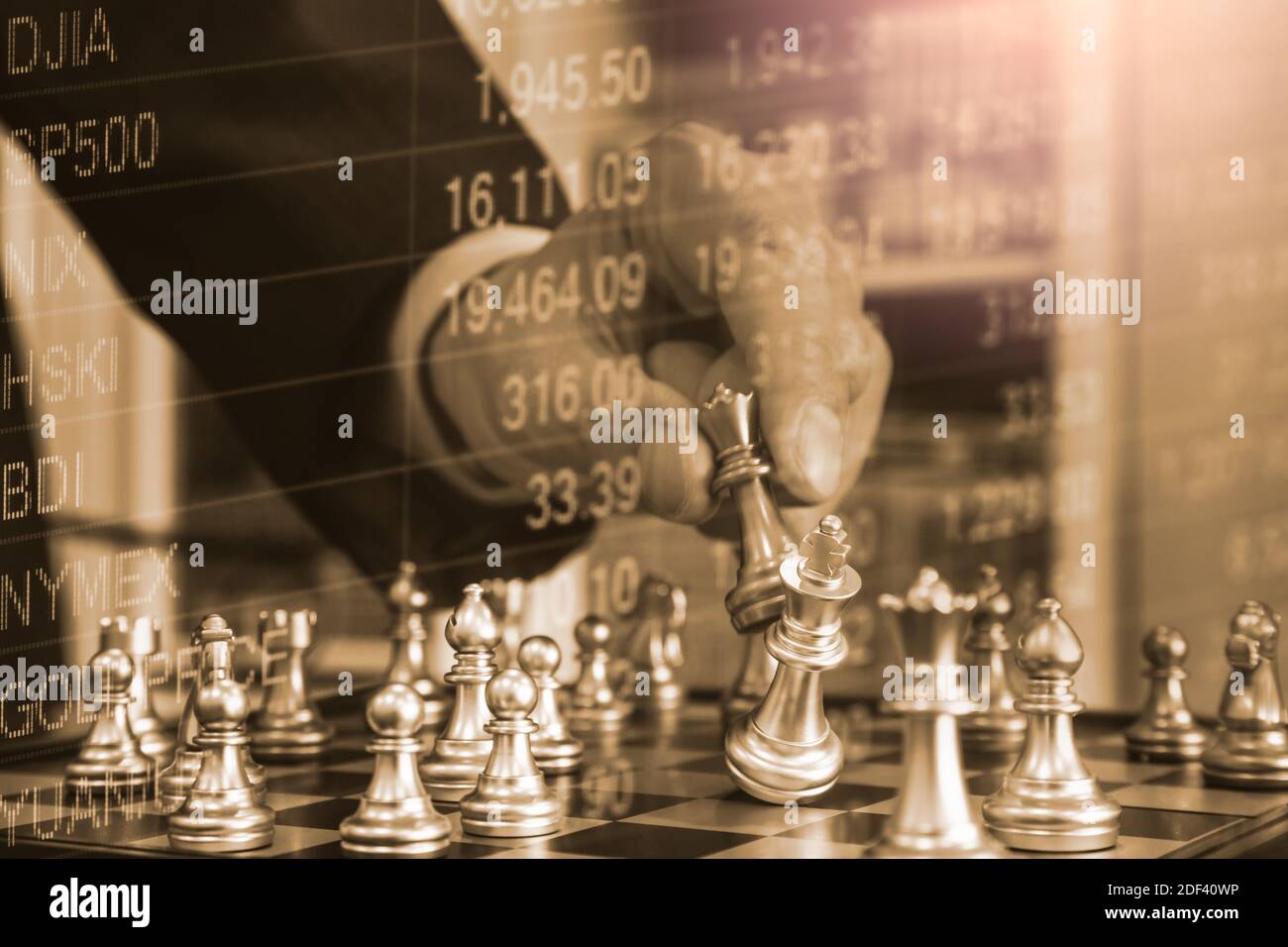 Chess game on chess board behind business man background. Business ...