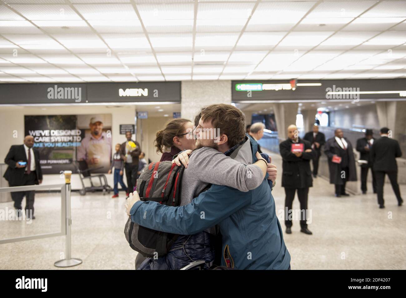 Passengers are greeted upon their arrival from Dubai after a 14-hour ...