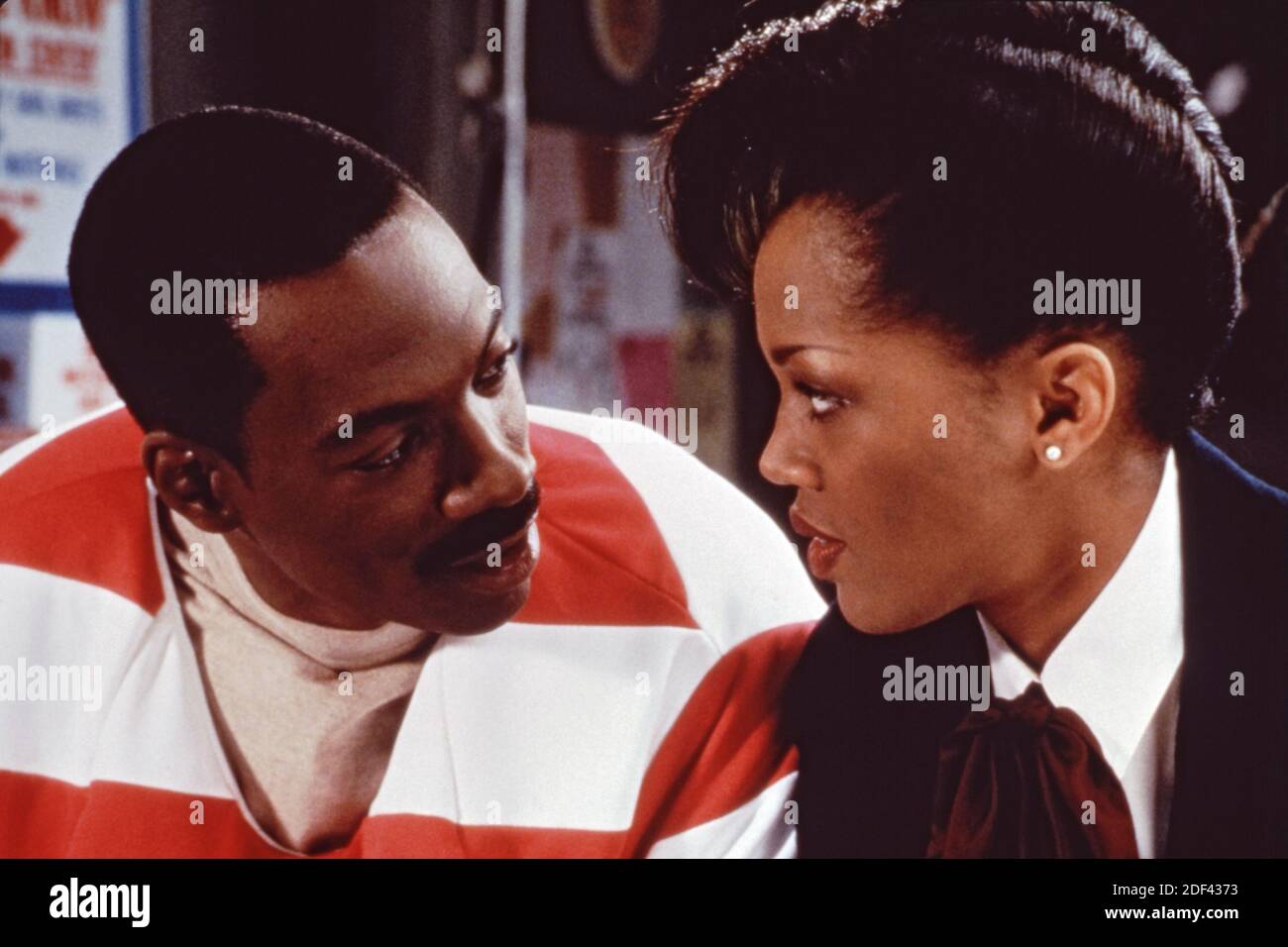 Eddie Murphy as Detective Axel Foley and Theresa Randle as Janice ...