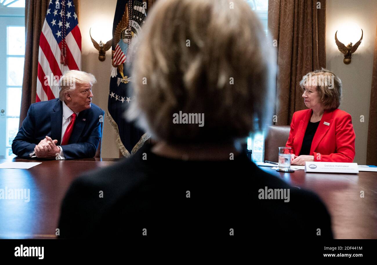 President Donald Trump (L) speaks to Debbie Hatmaker (R), Chief Nursing ...