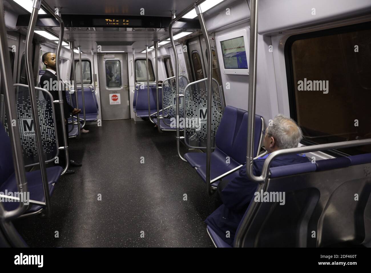Passenger keep a social distance as they ride a train in Washington ...