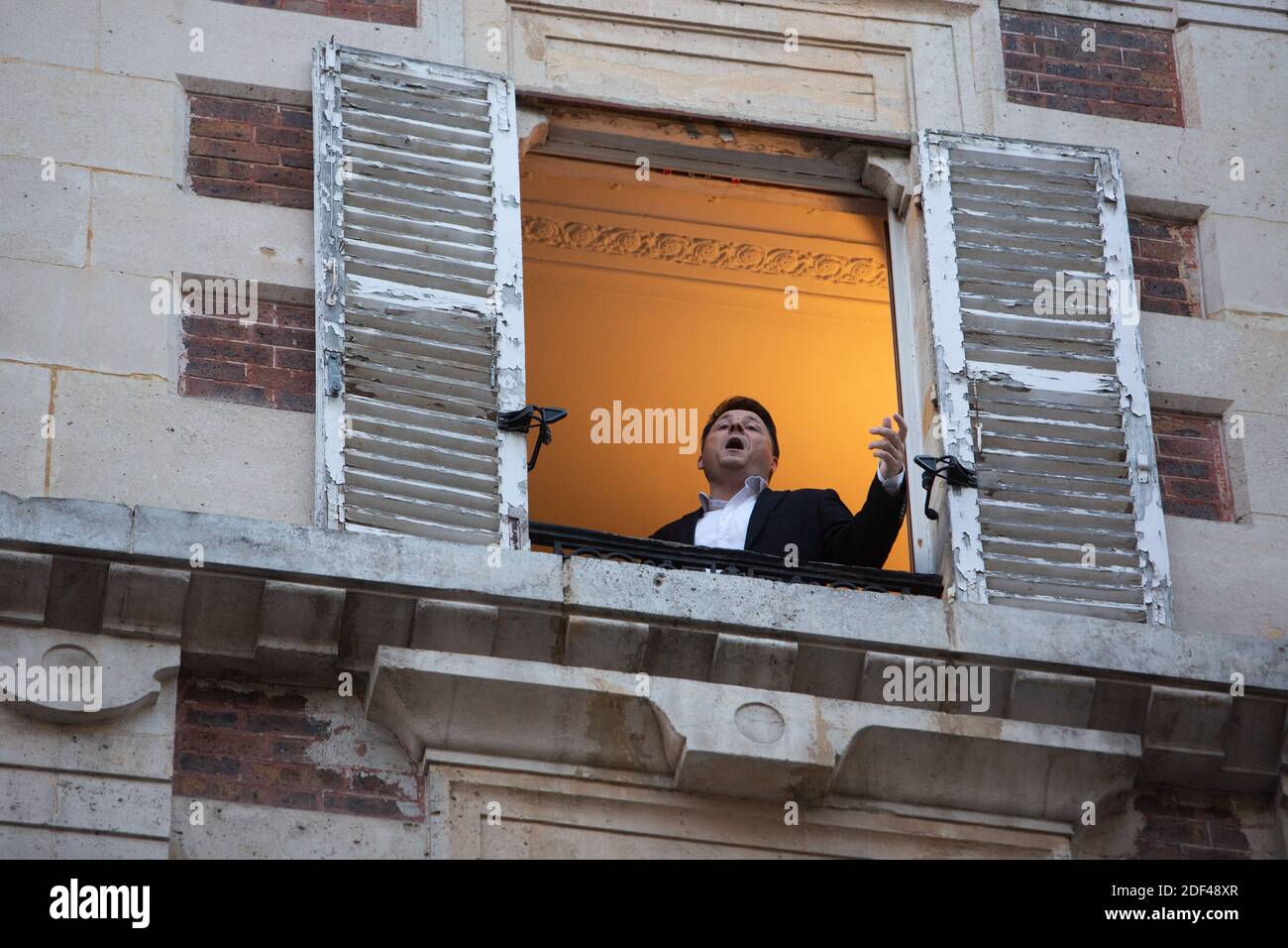 French opera singer Stephane Senechal performs for his neighbours from ...