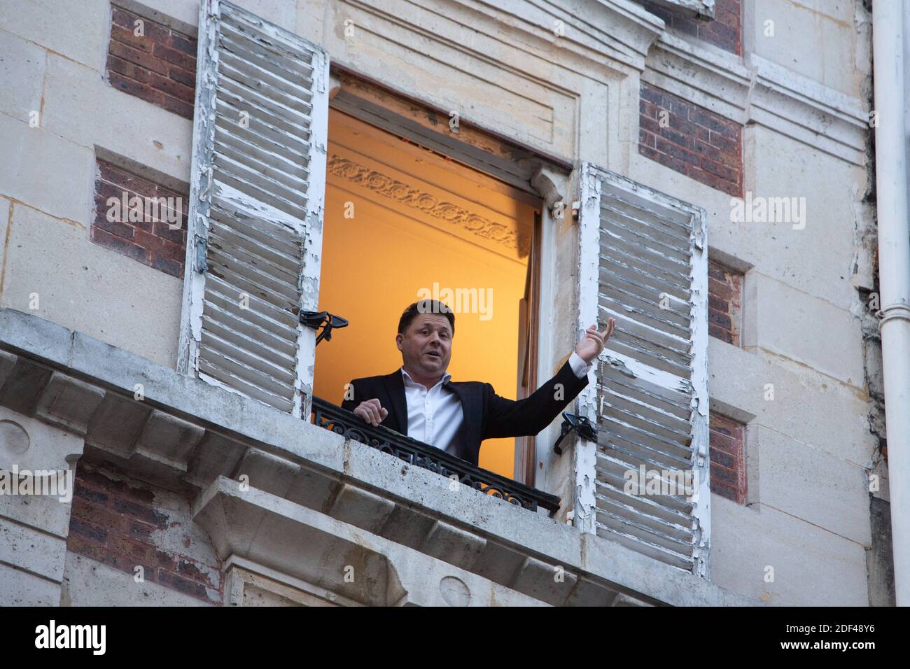 French opera singer Stephane Senechal performs for his neighbours from ...