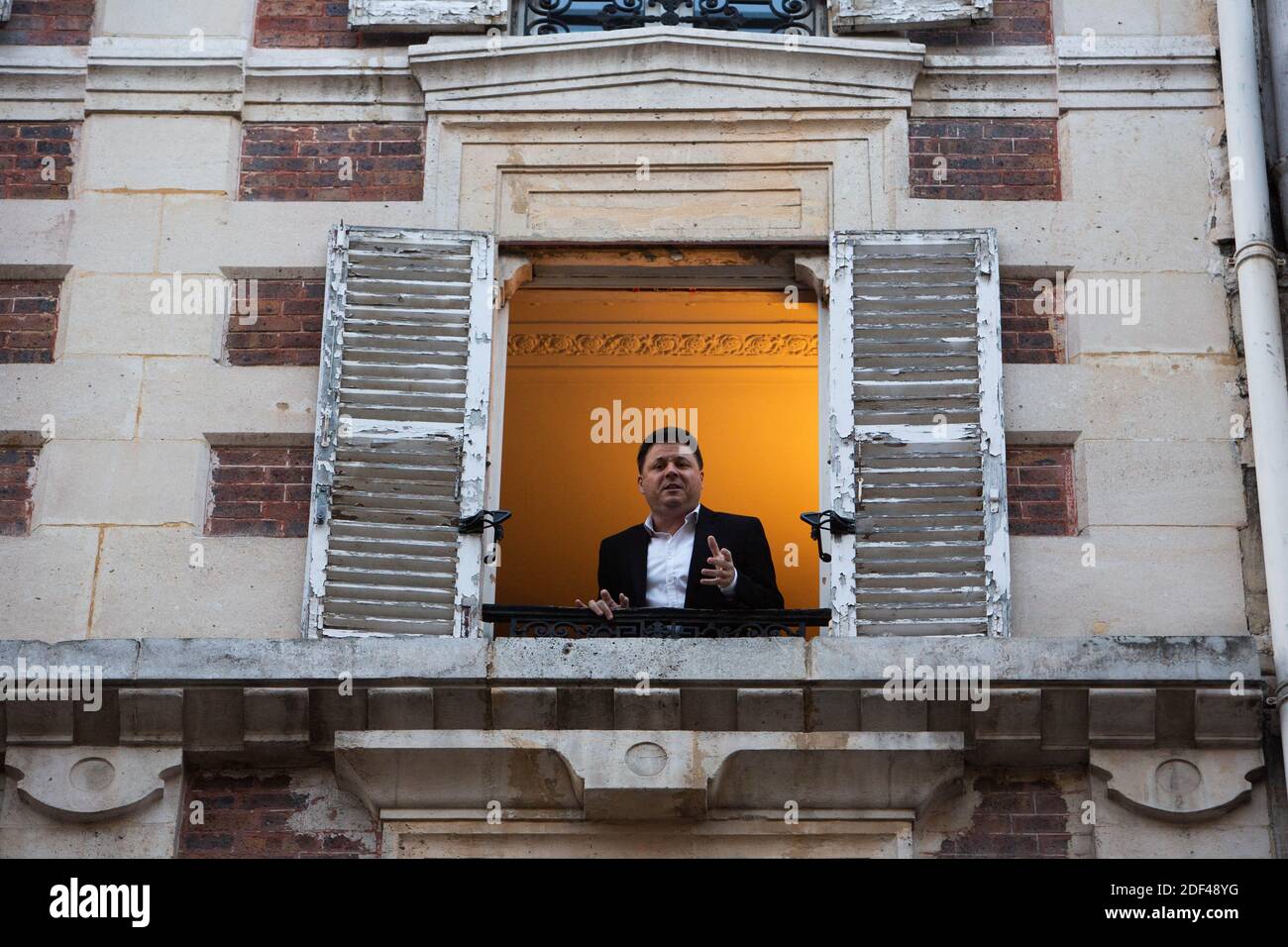 French opera singer Stephane Senechal performs for his neighbours from ...