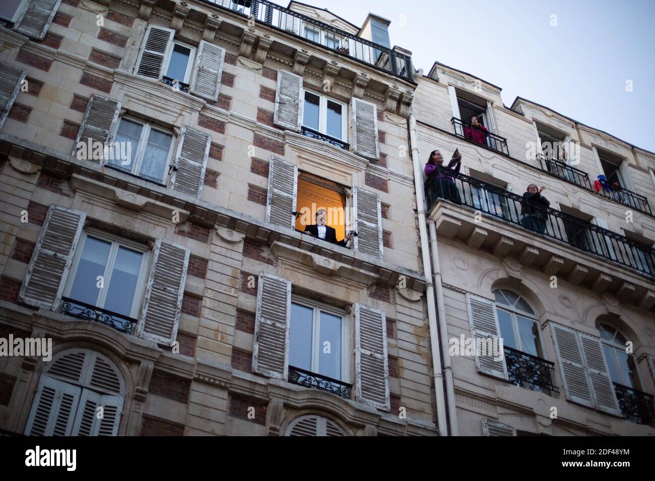 French opera singer Stephane Senechal performs for his neighbours from ...