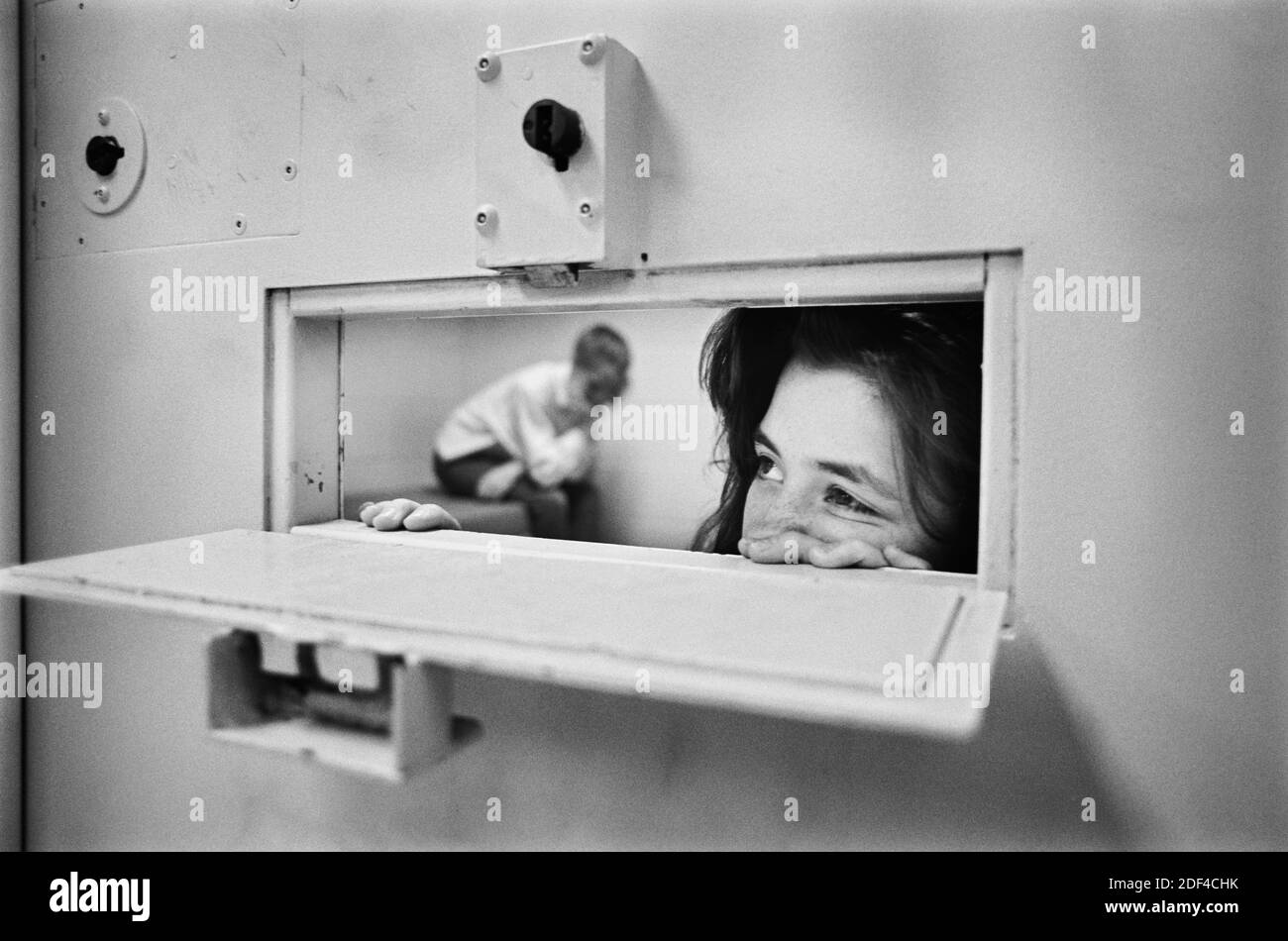 A young girl in a detention cell at a juvenile detention center. ** THE ...