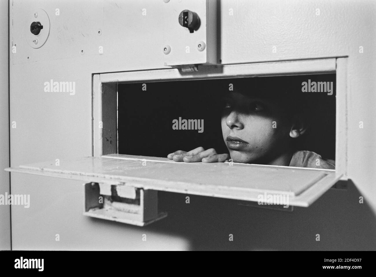 A young boy in a detention cell at a juvenile detention center. ** THE ...