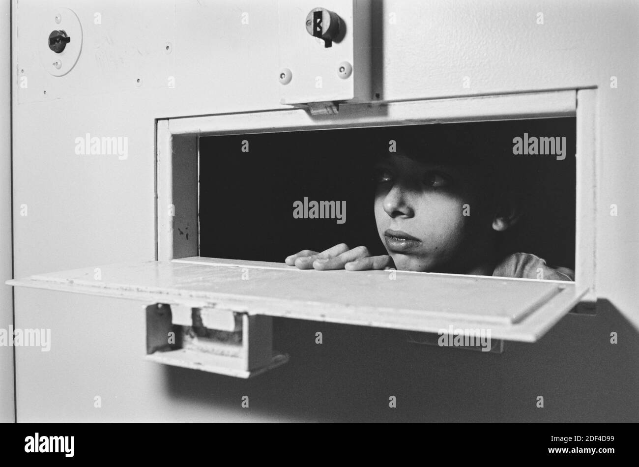 A young boy in a detention cell at a juvenile detention center. ** THE ...