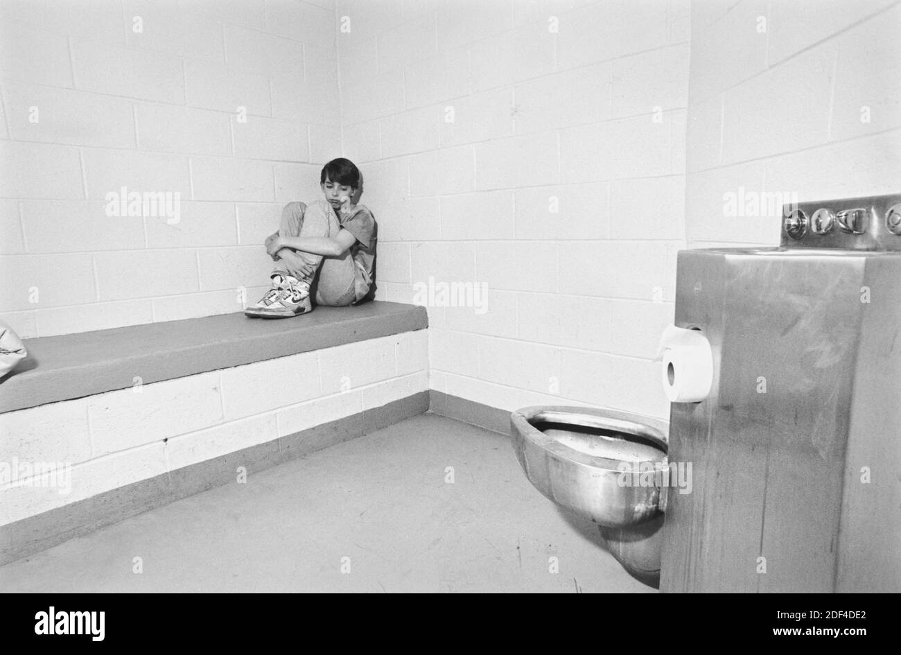 A young boy in a detention cell at a juvenile detention center. ** THE ...