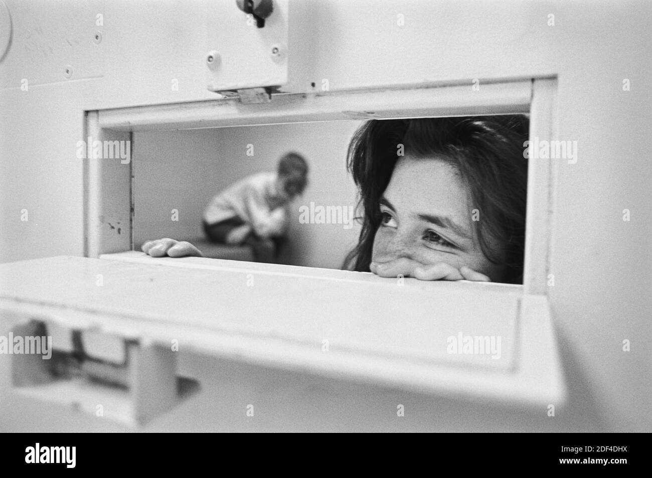 A young girl in a detention cell at a juvenile detention center. ** THE ...