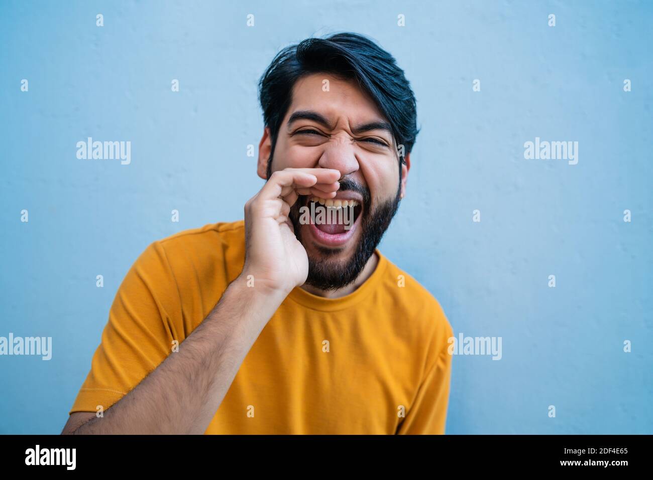 Young man shouting and screaming Stock Photo - Alamy