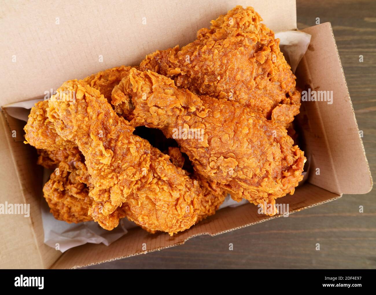 Box full of mouthwatering crispy fried chickens Stock Photo - Alamy