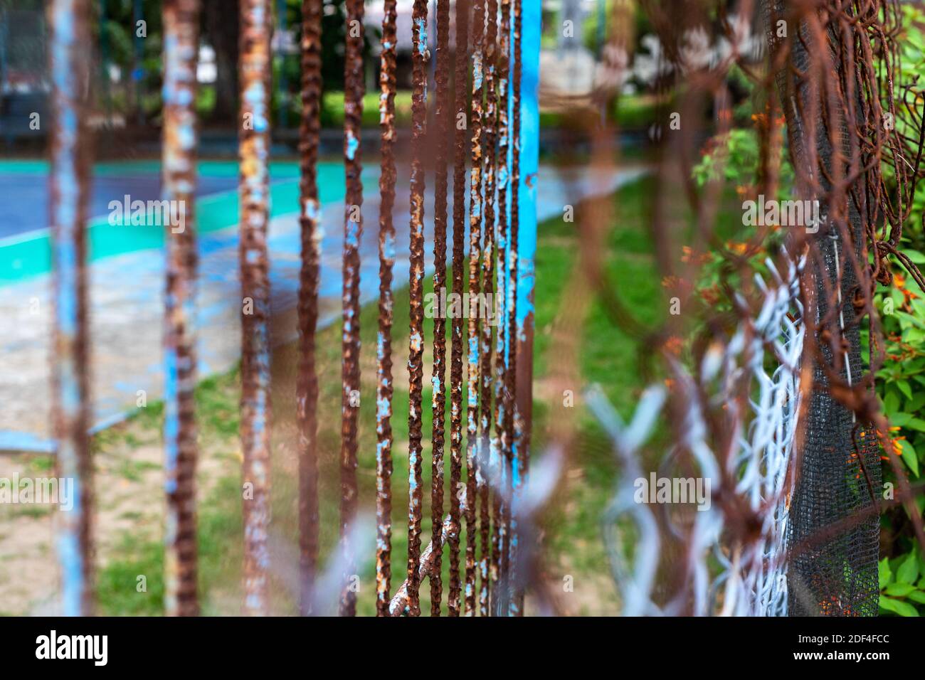 Rustic net fence and gate concept photo. Metallic net with brown rust ...