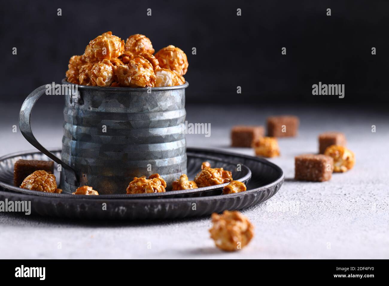 popcorn with caramel in a mug on the table Stock Photo - Alamy