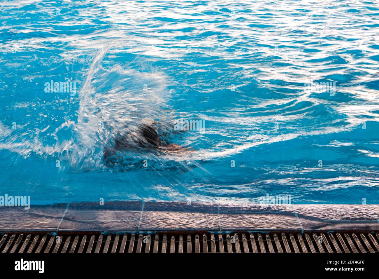 Swimmer and the ripple on the water surface in the swimming pool Stock ...