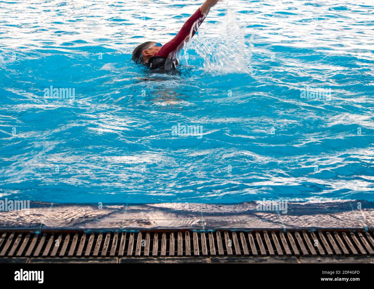 Swimmer and the ripple on the water surface in the swimming pool Stock ...