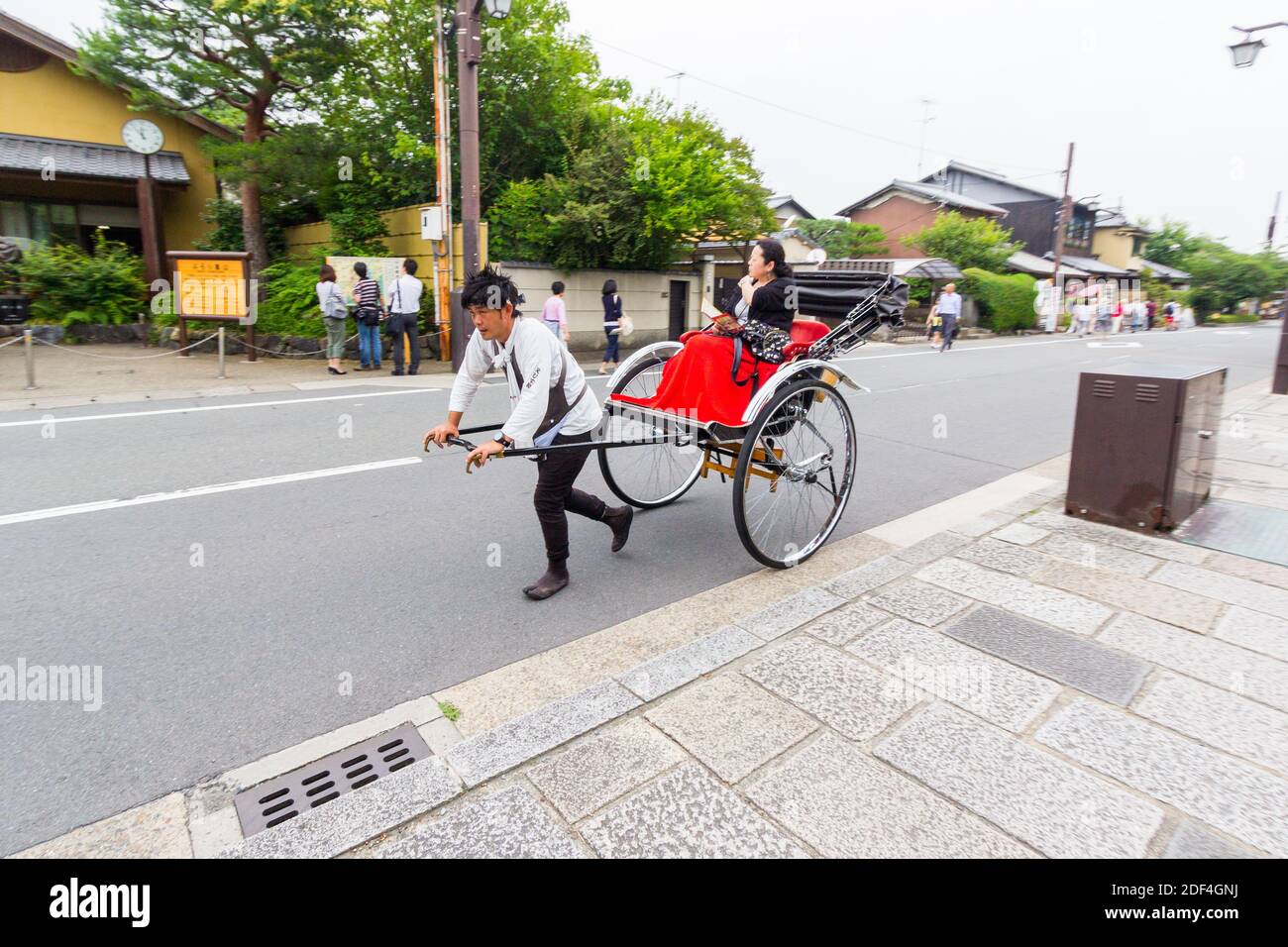 A rickshaw passenger on a street in Kyoto, Japan Stock Photo - Alamy