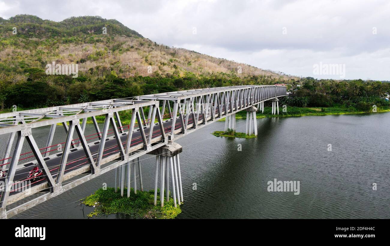 Aerial of long steel bridge in Kretek village, Yogyakarta, Indonesia ...