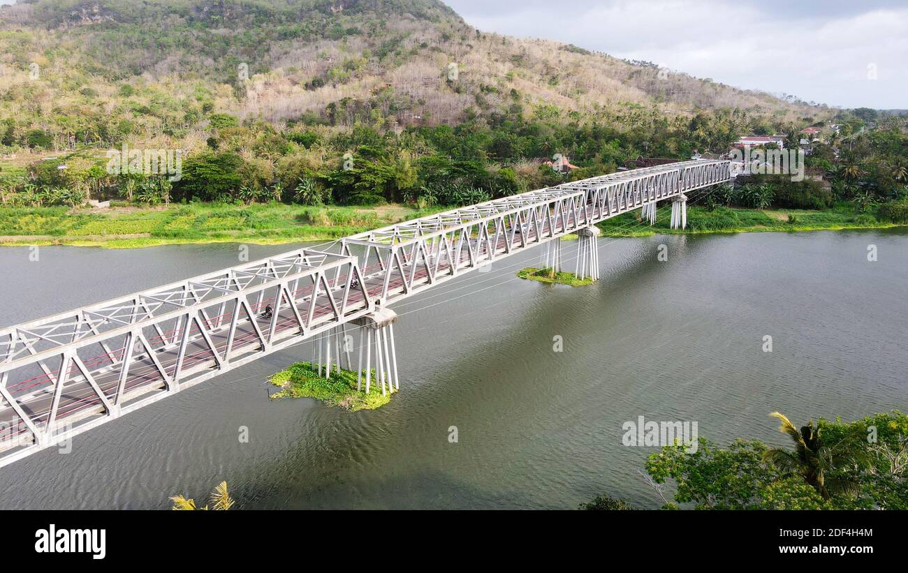 Aerial of long steel bridge in Kretek village, Yogyakarta, Indonesia ...