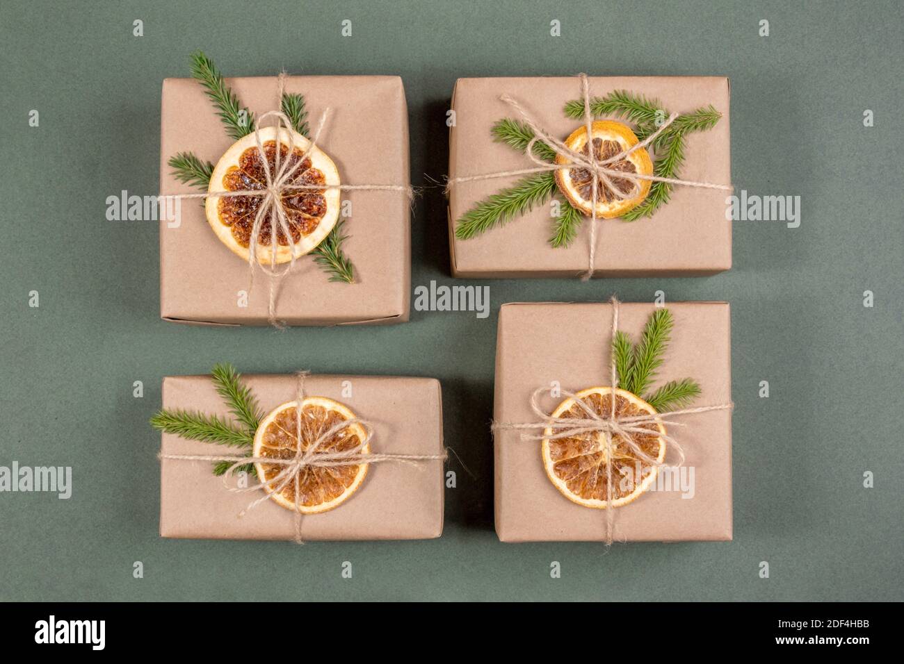 Christmas and New Year gifts. Craft paper boxes decorated with dried ...