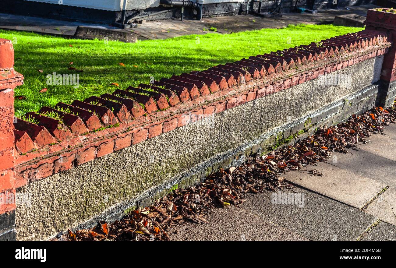 A front garden wall with coping of bricks Stock Photo - Alamy