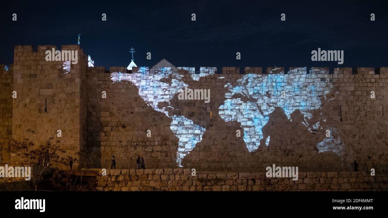 World map projected onto the Old City wall built in the 16th century by ...