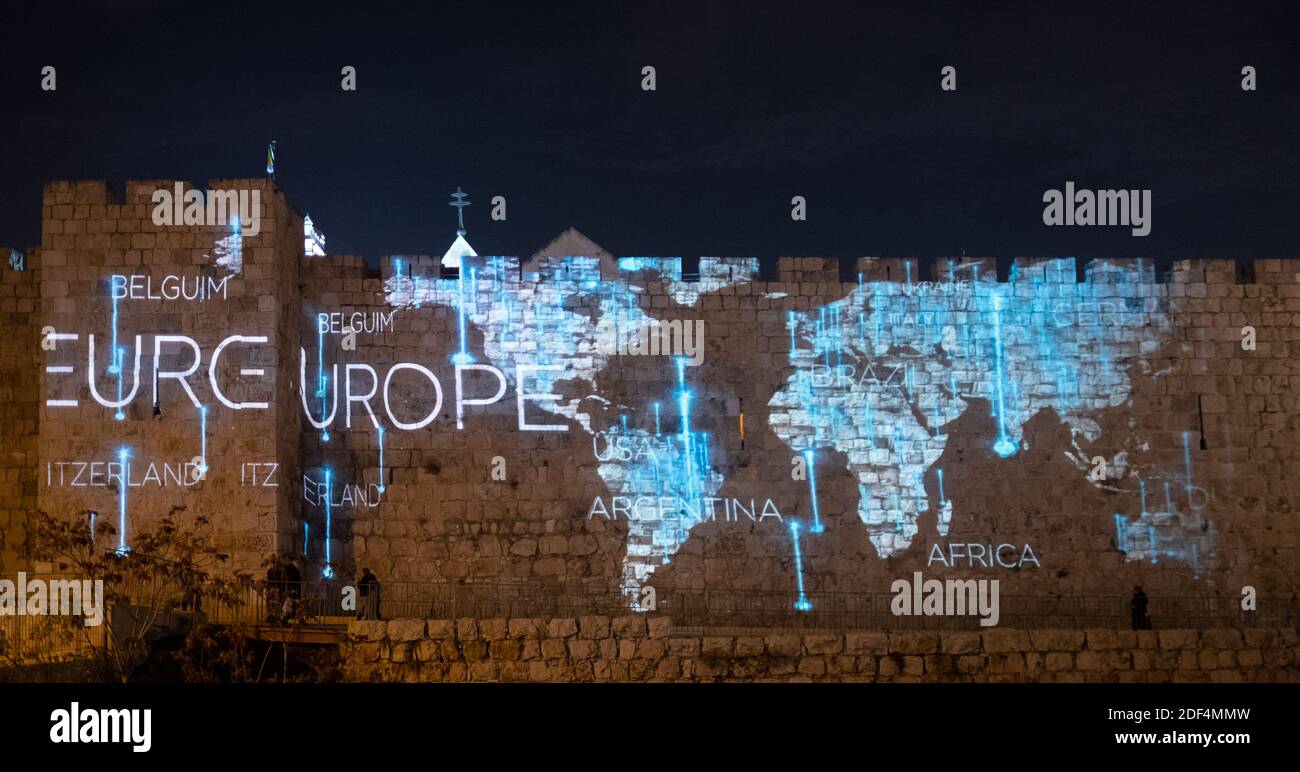World map projected onto the Old City wall built in the 16th century by ...