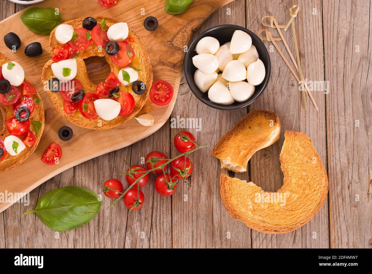 Friselle with tomatoes and mozzarella cheese Stock Photo - Alamy