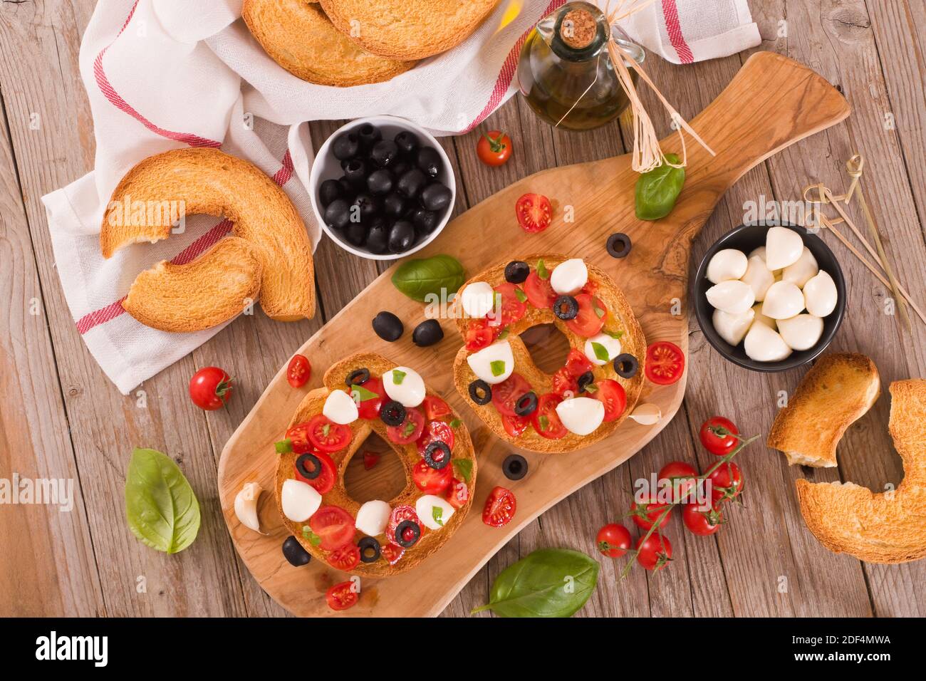 Friselle with tomatoes and mozzarella cheese Stock Photo - Alamy