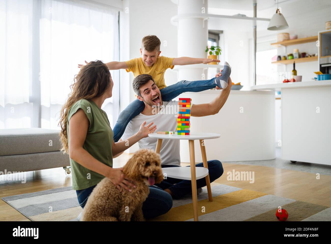 Happy young family having fun together at home. Happy childhood concept ...