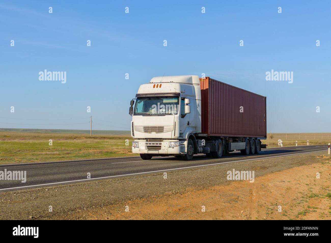 Front-View of Semi-Truck with Cargo Trailer Driving on a Highway. He's ...