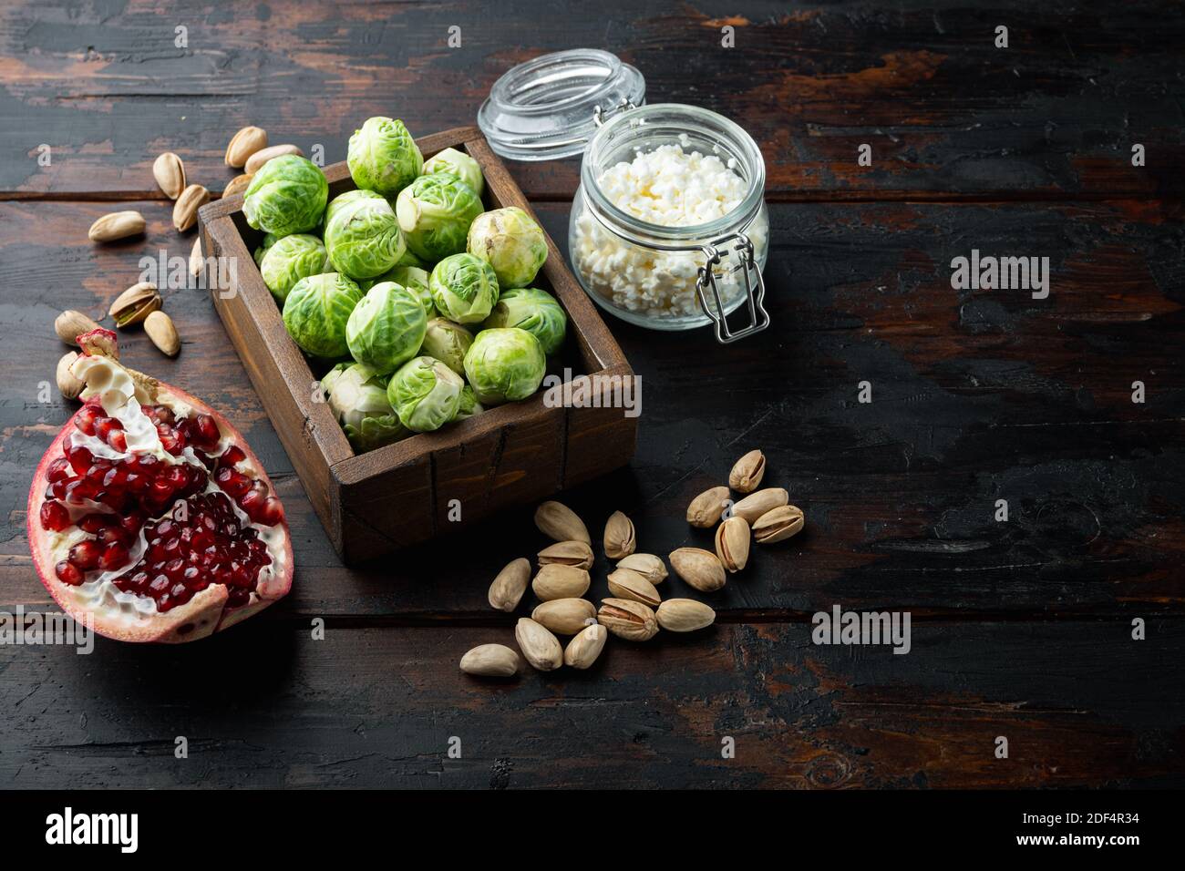 Gnarly garlic brussels ingredient, on old wooden table with space for ...
